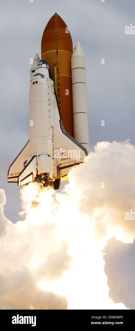 The space shuttle Atlantis lifts off from the Kennedy Space Center ...
