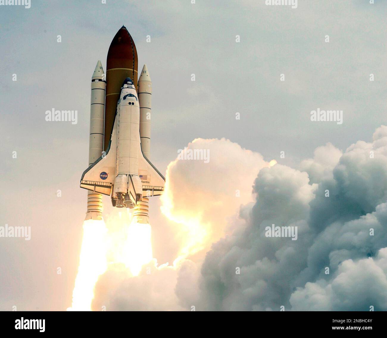 The space shuttle Atlantis lifts off from the Kennedy Space Center ...