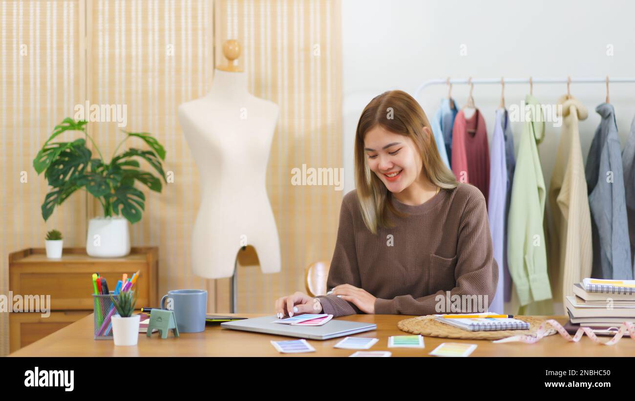 Fashion design concept, Fashion designer drawing and choosing color for ...