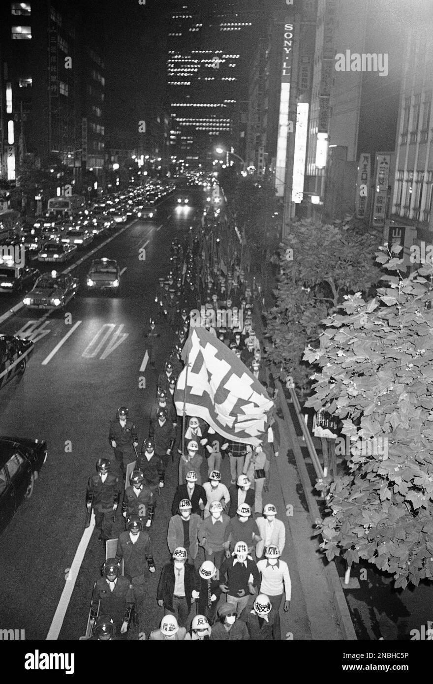 Flanked by riot police, members of the Chukaku faction of Japanese ...