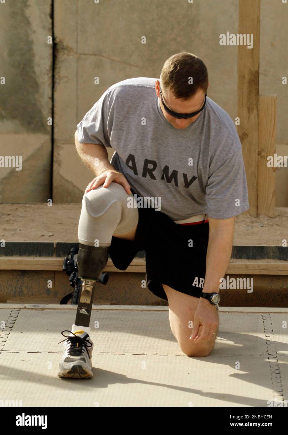 U.S. Army Maj. David Rozelle stretches before a physical fitness test ...