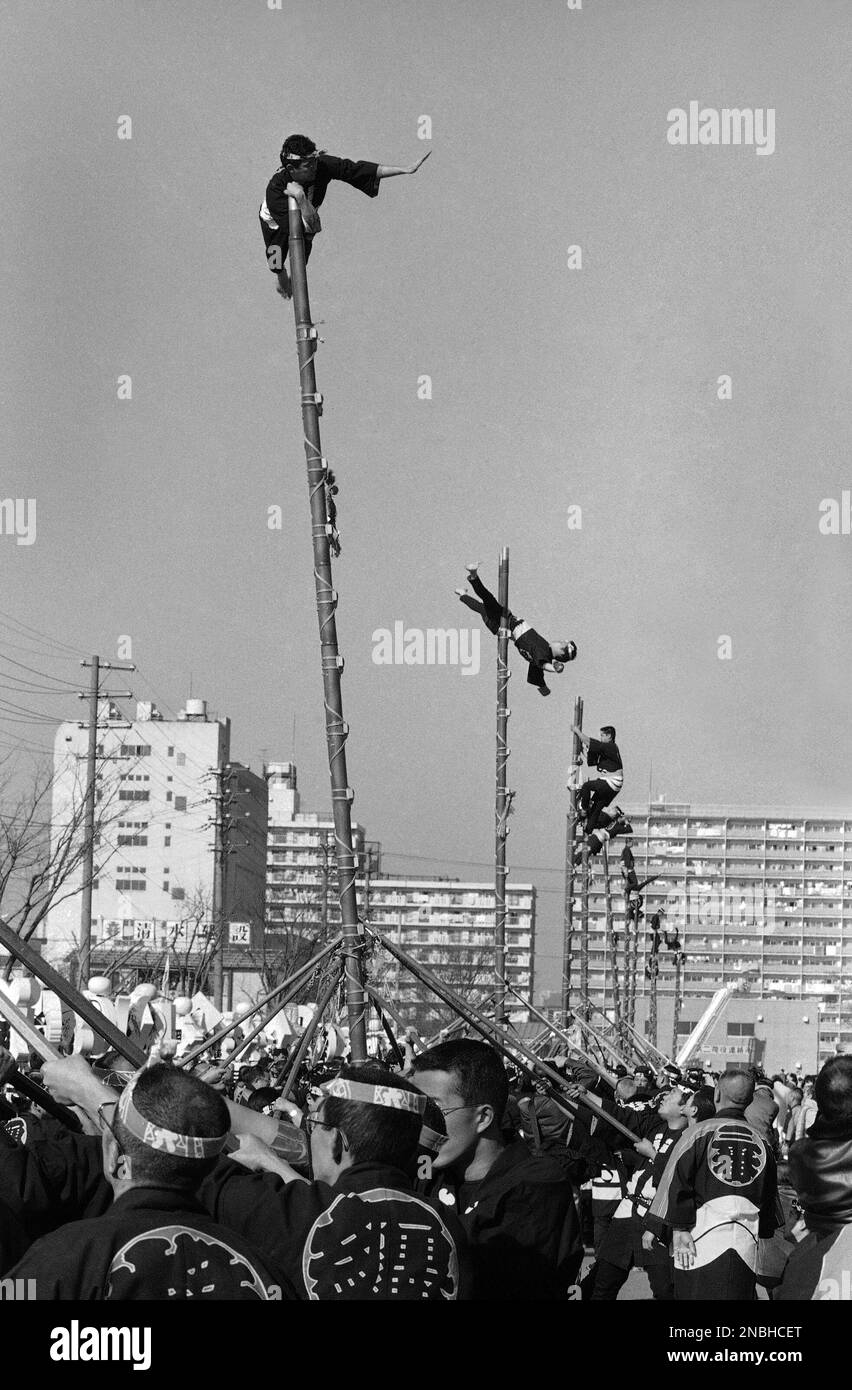 Members of a group preserving Edo Firefighters' skills perform stunts ...