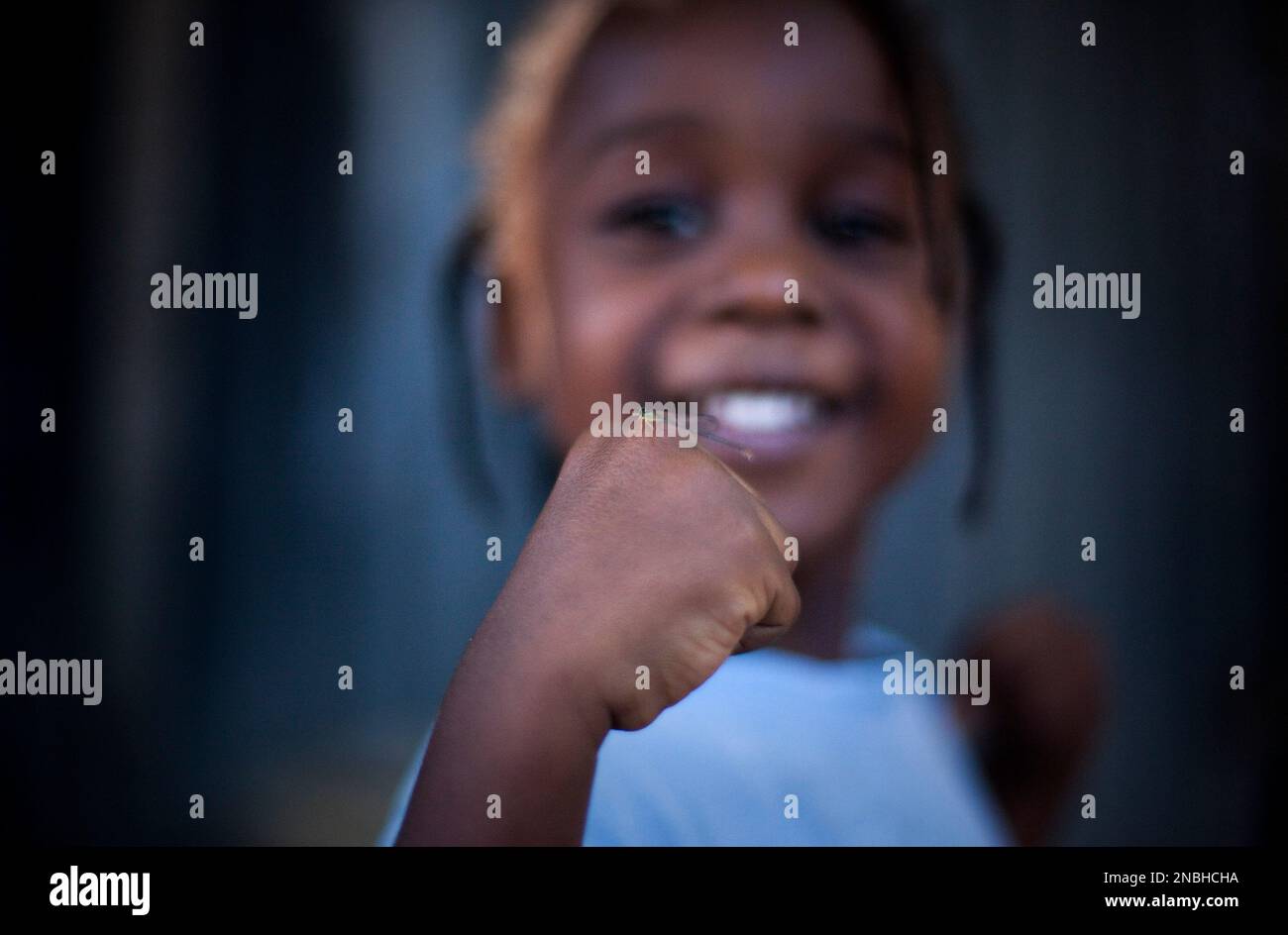 Four-year-old Schneily Similien shows a dragonfly posed on his arm at ...