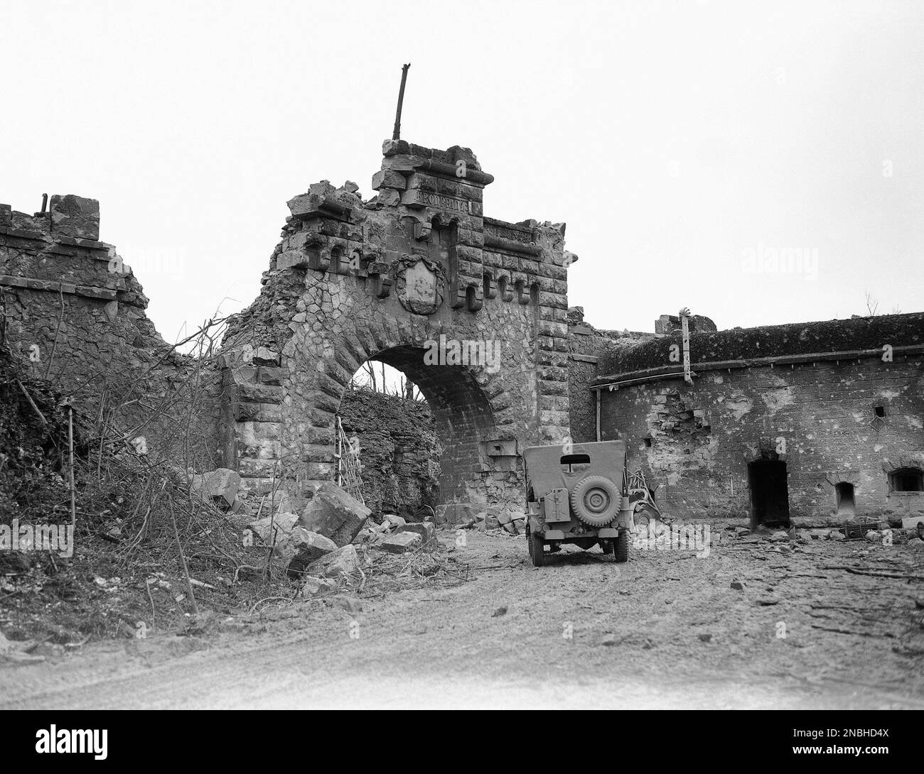 An American jeep makes its way towards the main entrance of a fort on ...