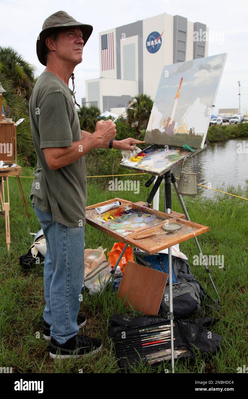 Winter Park, Fla. Artist, Larry Moore paints the scene at he Kennedy ...