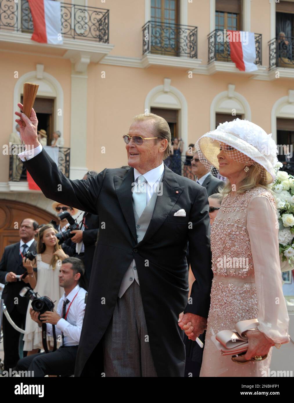 British actor Roger Moore and his wife Kristina arrive for the wedding ...