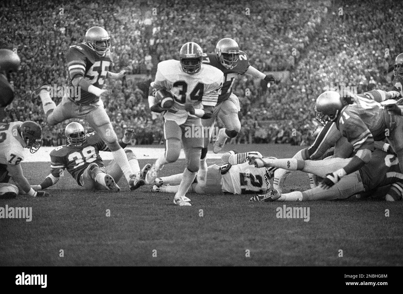 Pittsburgh's Joe McCall (34) breaks through the Notre Dame line to ...