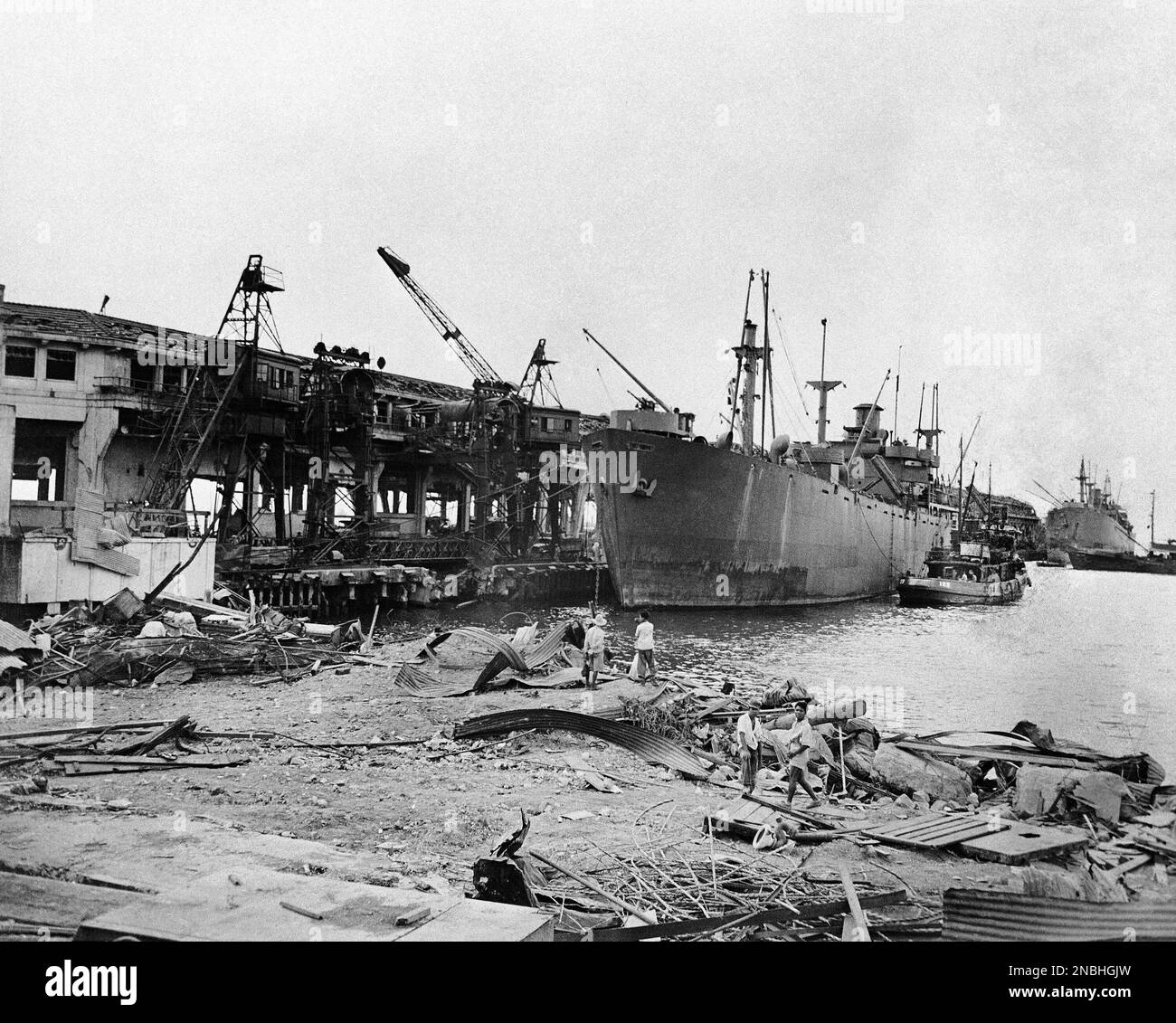The first two cargo ships to enter Manila Harbor, Philippines, after it ...