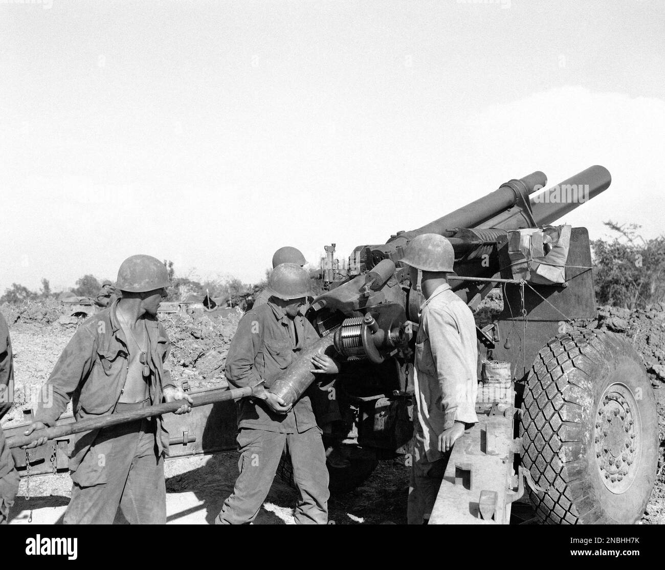 A battery of 155mm howitzers, in position on a hill near Manaoag ...