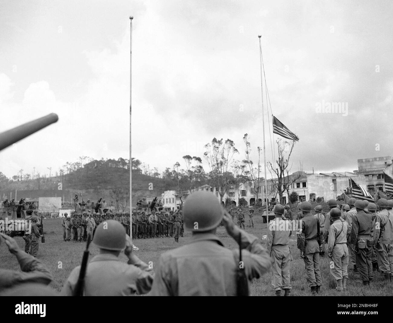 Soldiers stand at attention as the American Flag is raised in Baguio ...
