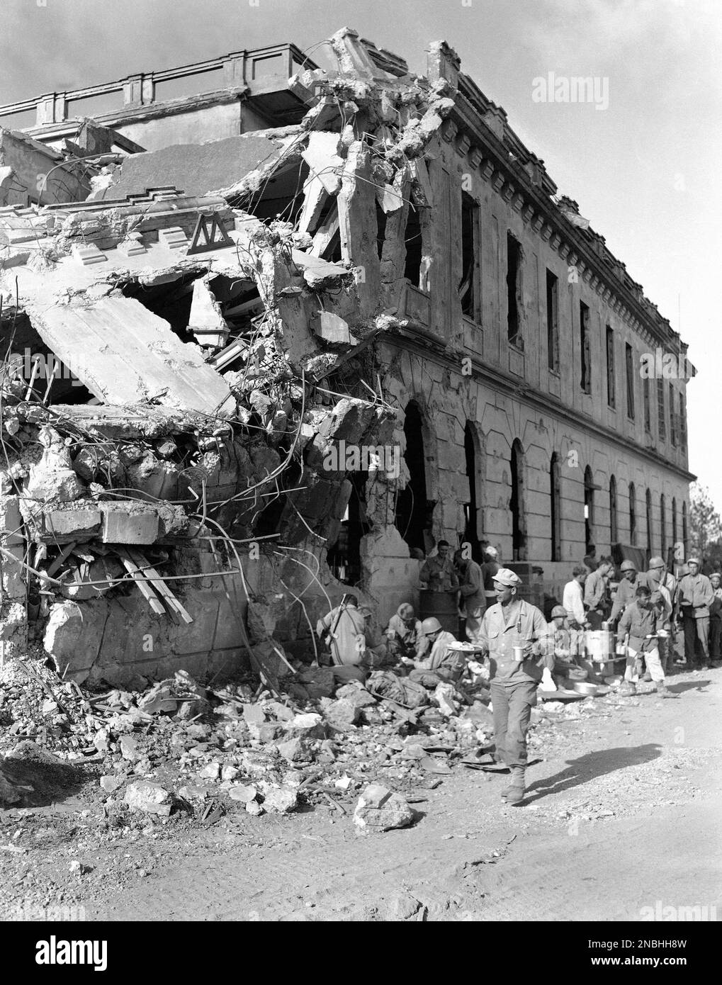 Soldiers of the 130 Infantry, 33rd Division, get their evening meal ...