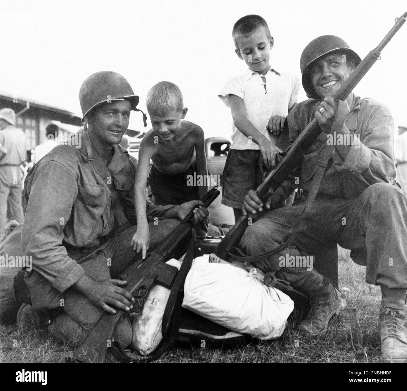 Two youths, both of whom were liberated by American forces at Los Banos ...