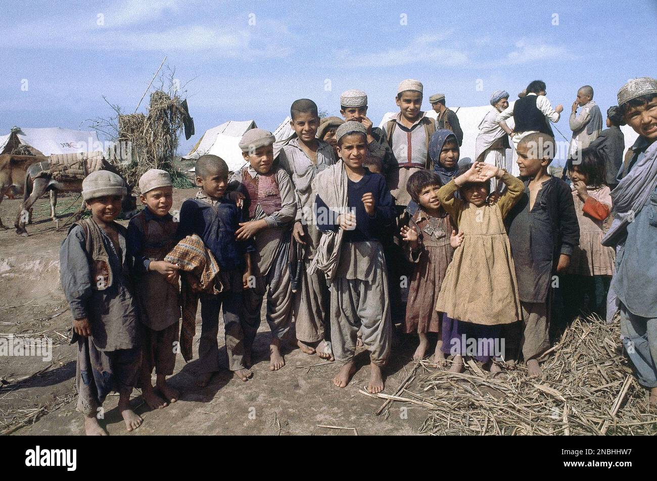 Afghan refugee children are shown in a camp on Kohat Road outside of ...