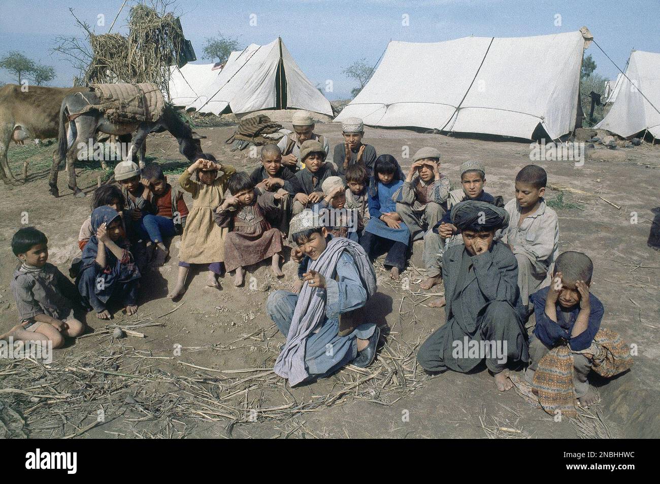 Afghan refugee children are shown in a camp on Kohat Road outside of ...