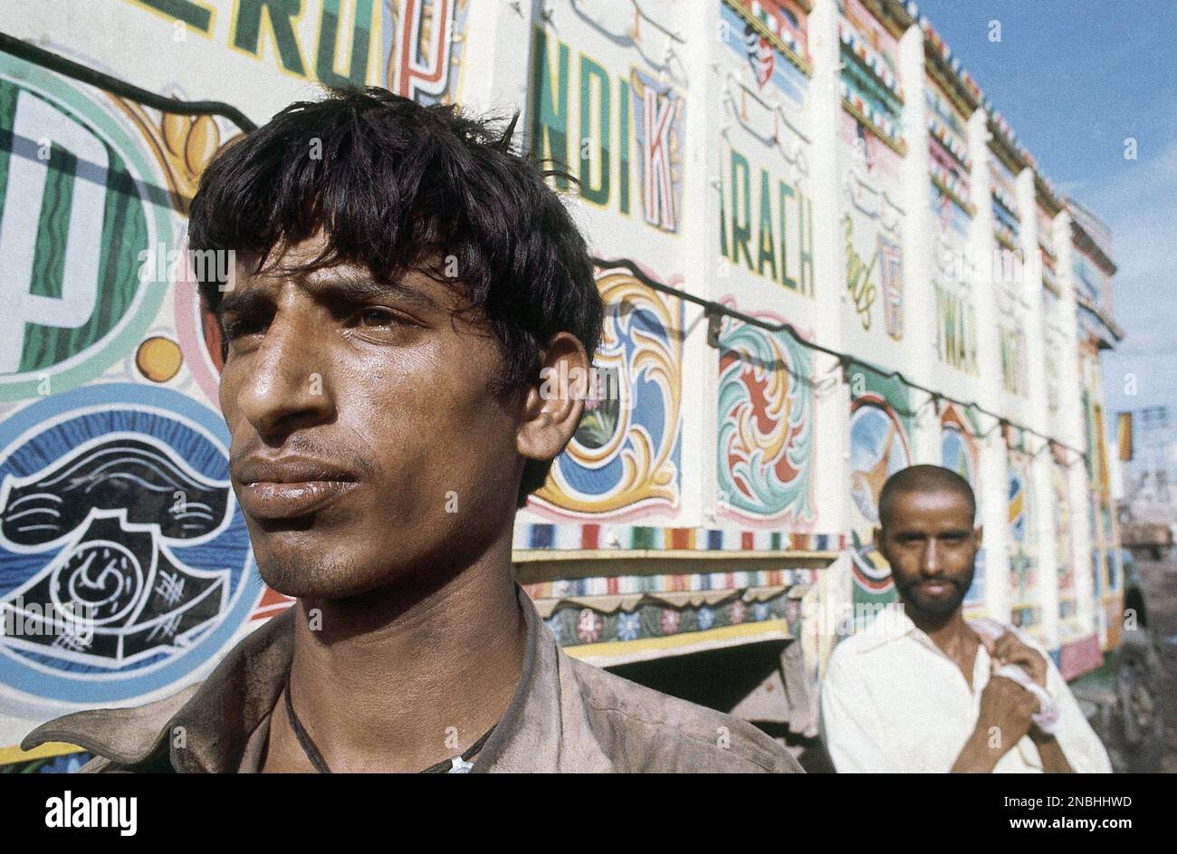 Some men stand around the market in old Rawalpindi, Pakistan, July 8 ...