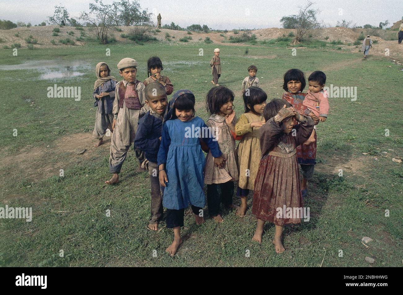 Afghan refugee children are shown in a camp on Kohat Road outside of ...