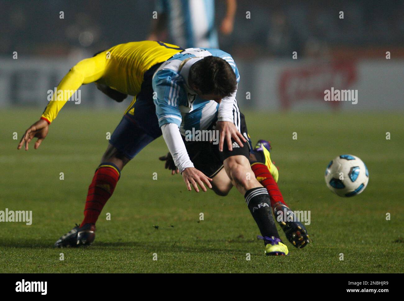 Argentina's Lionel Messi and a Colombian player fight for the ball ...