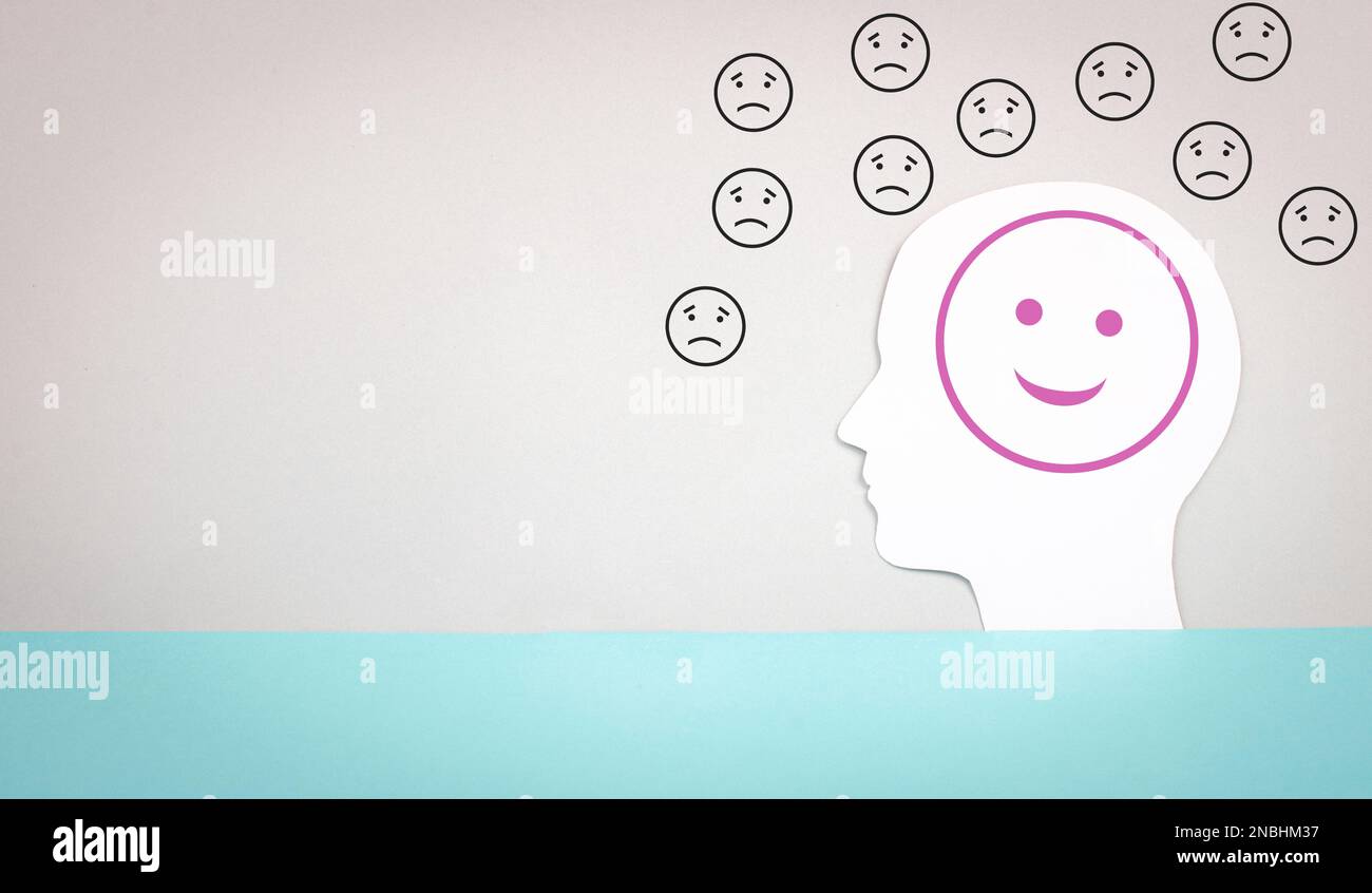 Head with a happy smiling face surrounded by sad people , mental health ...