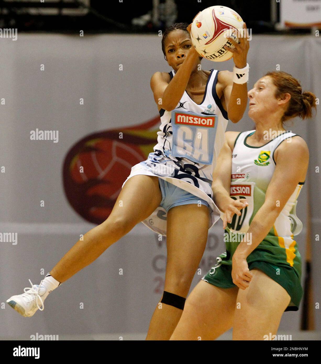 Portia Rasekhumba of Botswana, left, catches the ball near Amanda ...