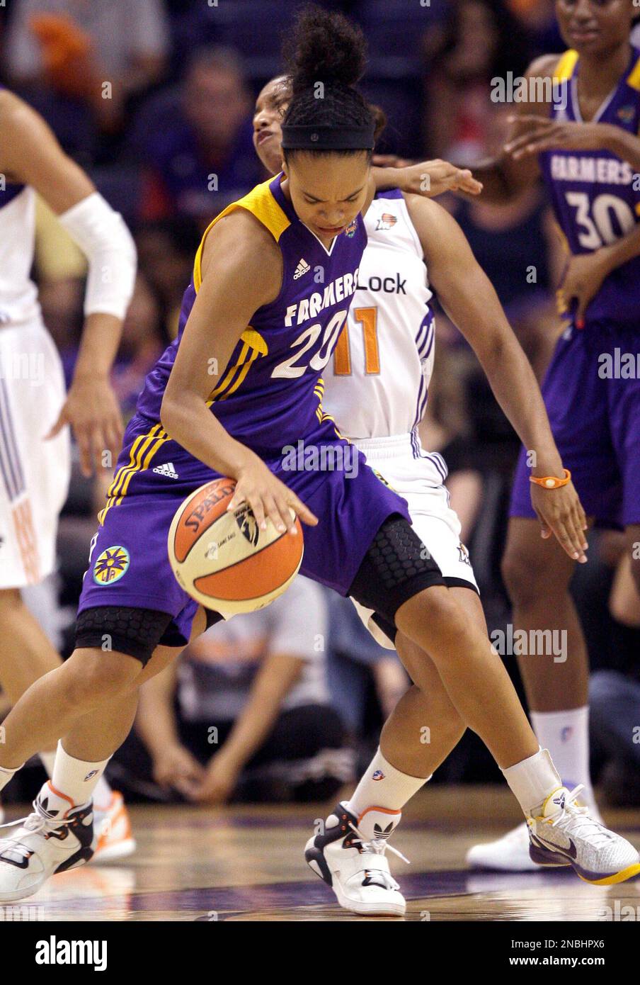 Los Angeles Sparks' Kristi Toliver (20) elbows Phoenix Mercury's Ketia ...