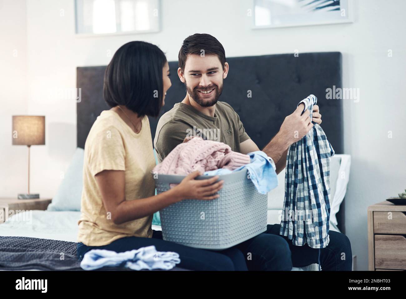Turning daily domestic tasks in quality time. a young couple doing ...