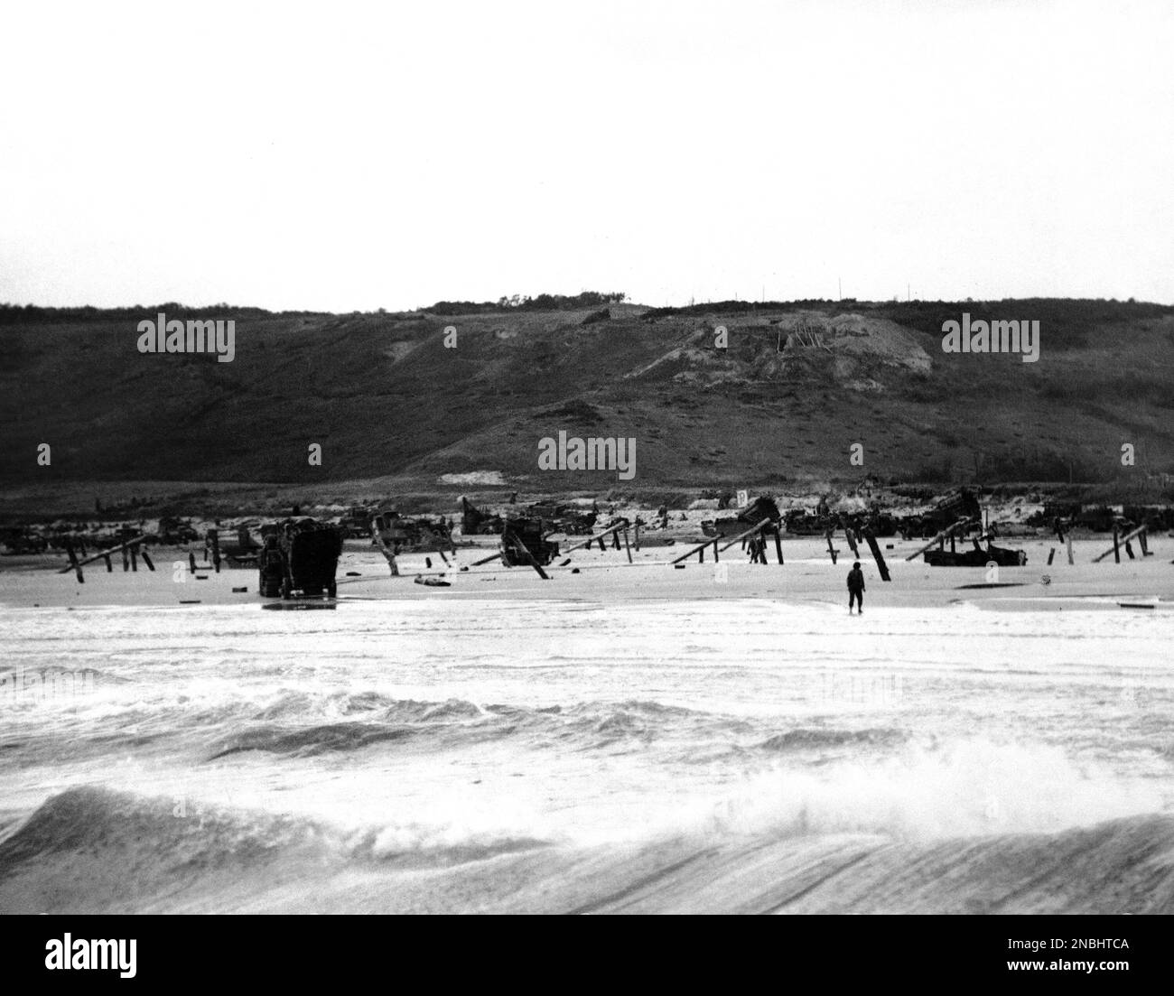 On a beach on the French invasion coast stand defenses of steel and ...