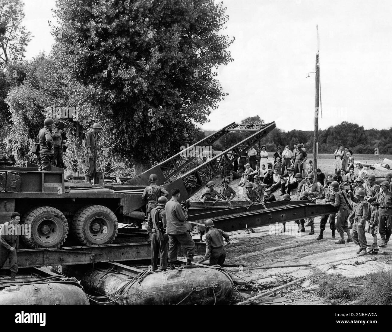 The U.S. army engineers bridged the river seine by means of pontoon ...