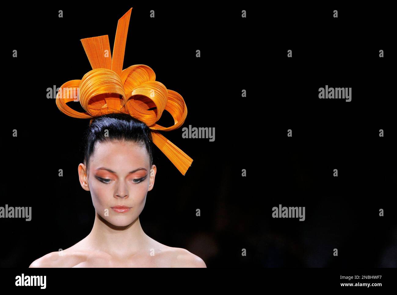 A model wears a creation for the Giorgio Armani Fall-Winter 2011-2012 ...