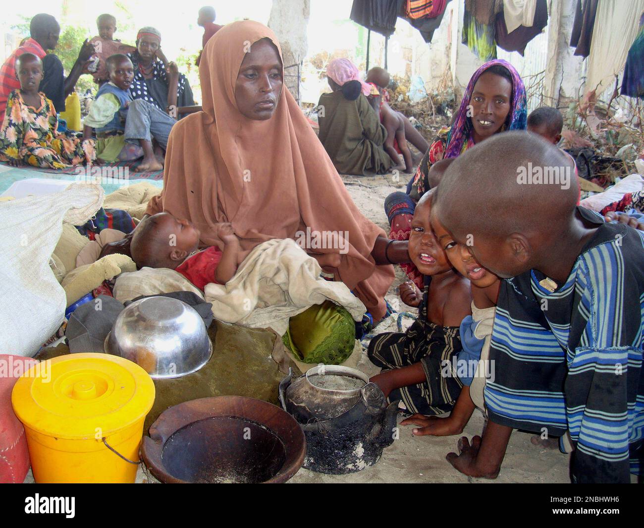 A Somali family displaced by drought, sit in one of the internally ...