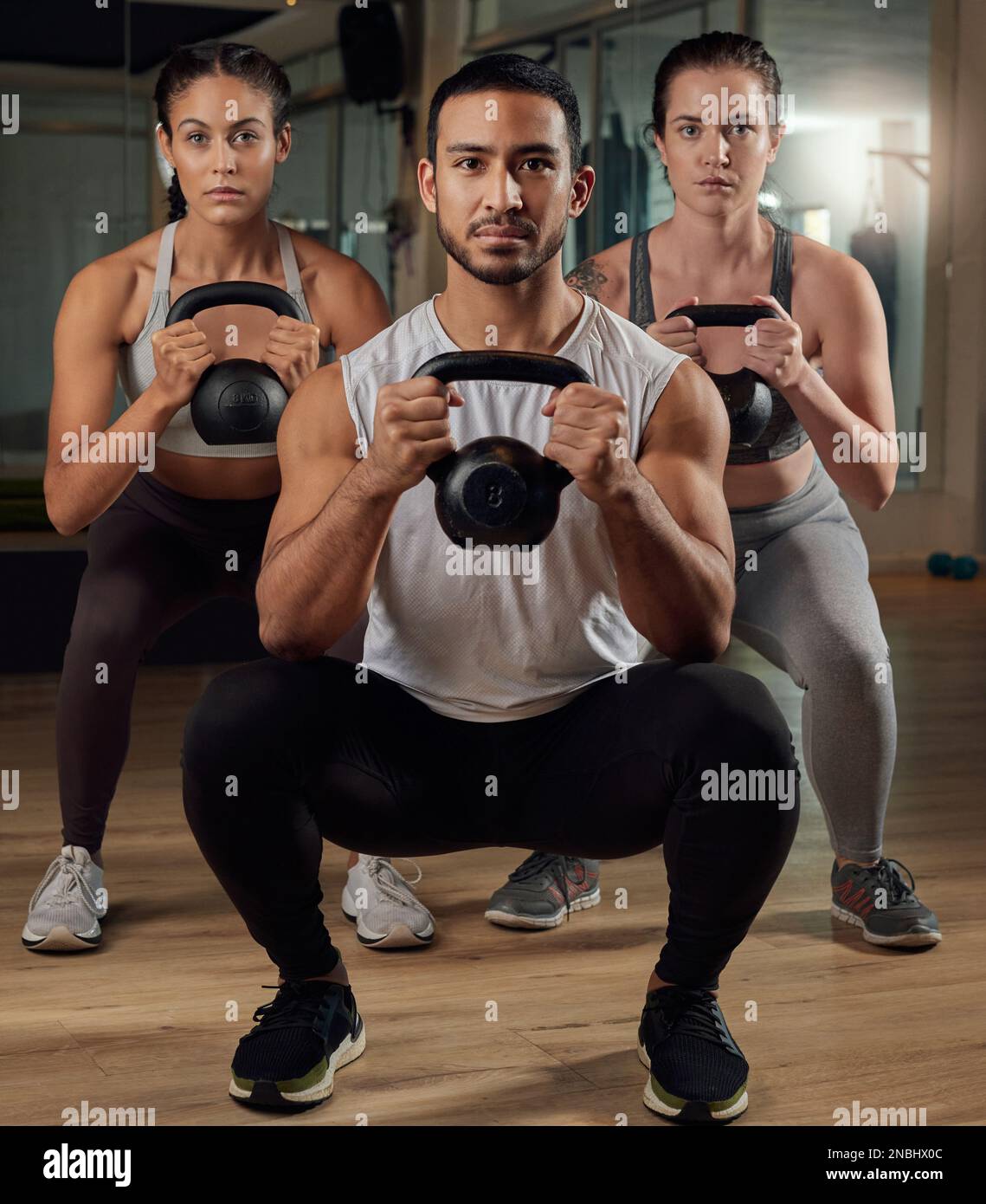 Its great for the quads. Full length portrait of three young athletes ...