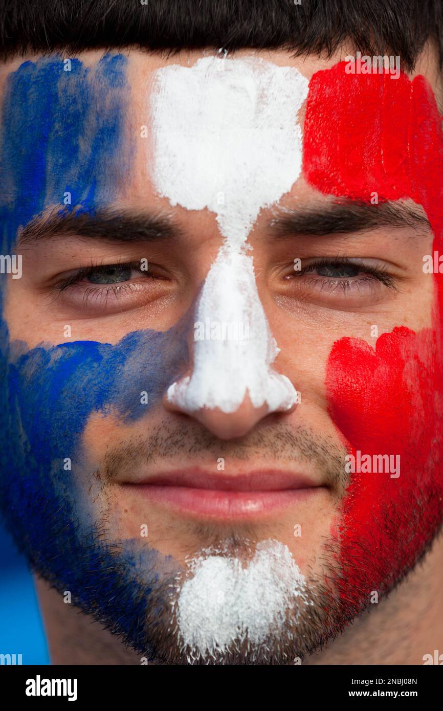 Kevin Cascone, of Westfield, N.J., poses with his face painted red, white, and blue at Nathan's ...