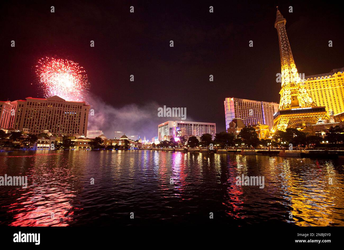 Light from Independence Day weekend fireworks is reflected in the water ...