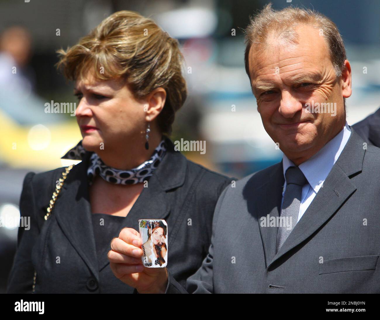 Bill Hawker displays a photo of his slain daughter Lindsay Ann Hawker ...