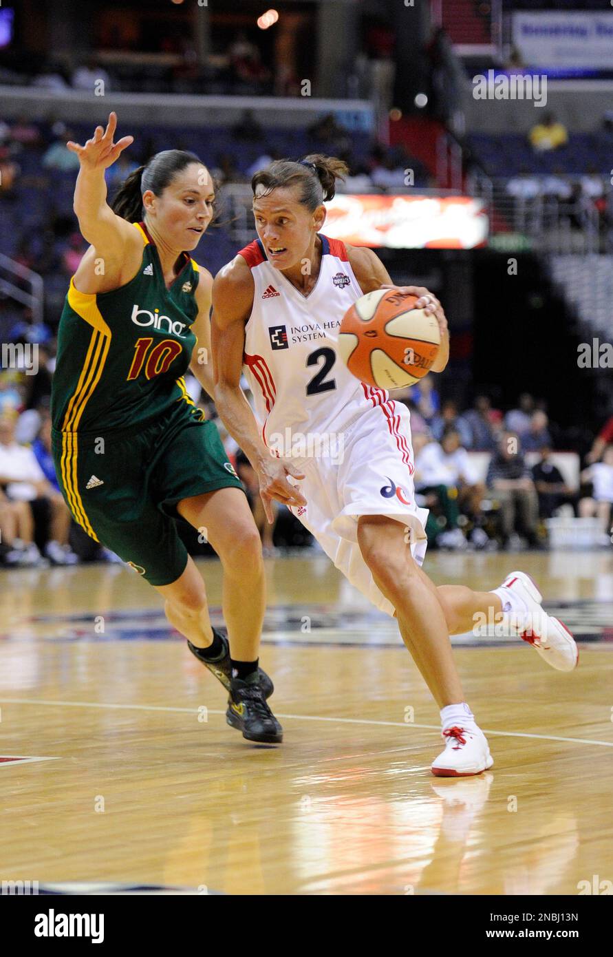 Washington Mystics' Kelly Miller (2) dribbles the ball against Seattle ...