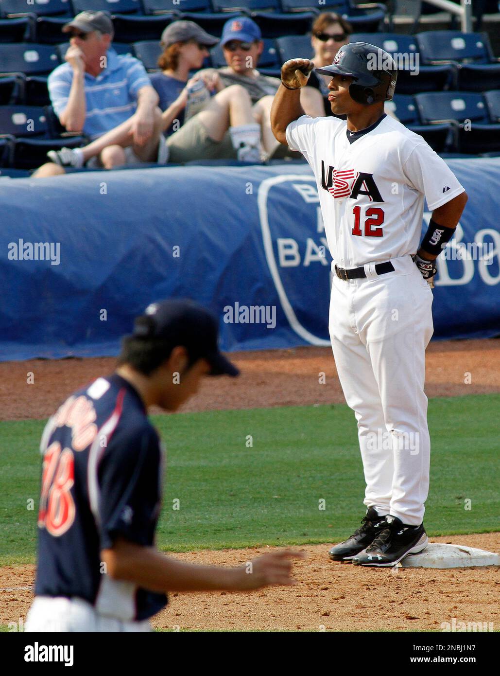 United States' Chris Elder (12) salutes after driving in a run during ...