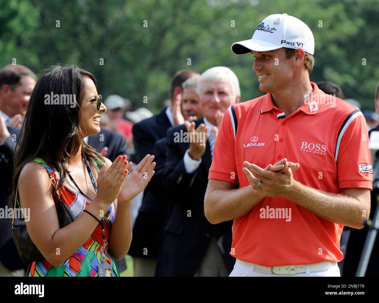 Nick Watney and his wife, Amber, applaud during ceremonies after Watney ...