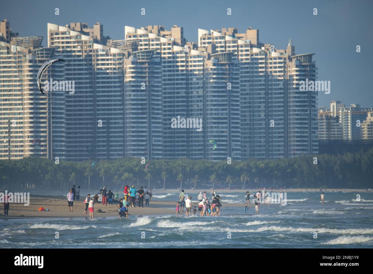 People play and swim on the Boao beach in Qionghai City, southernmost ...