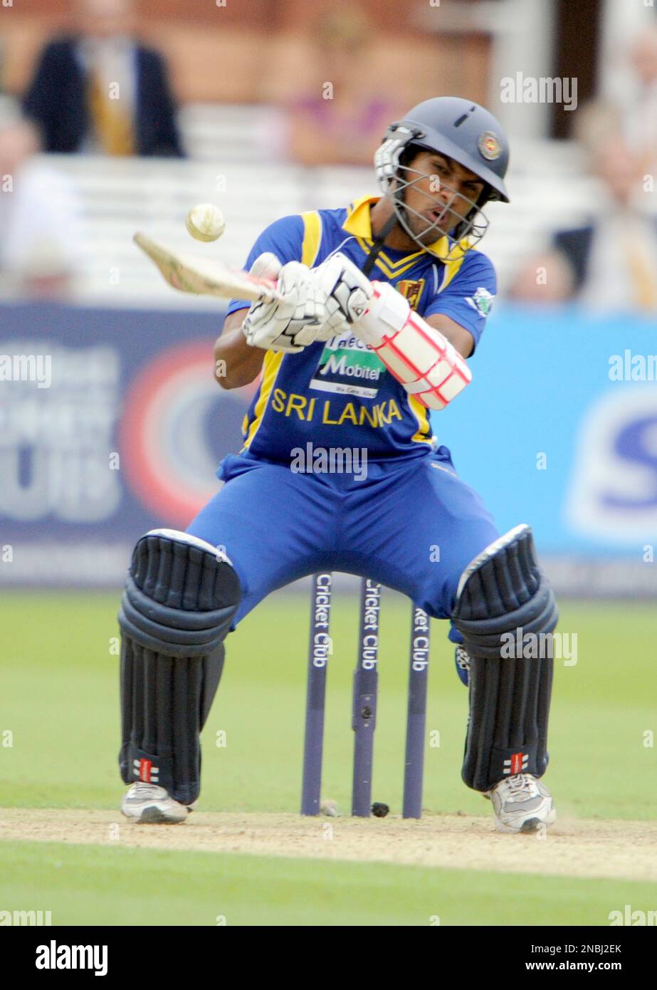 Sri Lanka's Dinesh Chandimal guides a ball from England's Tim Bresnan ...