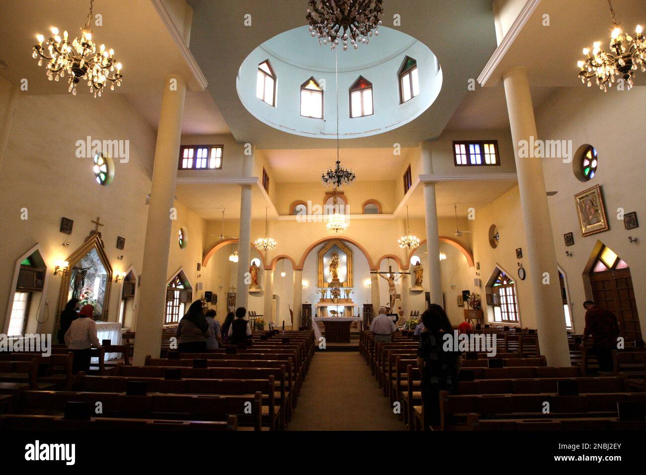 A Sunday mass is seen at Virgin Mary Chaldean Church in Baghdad, Iraq ...