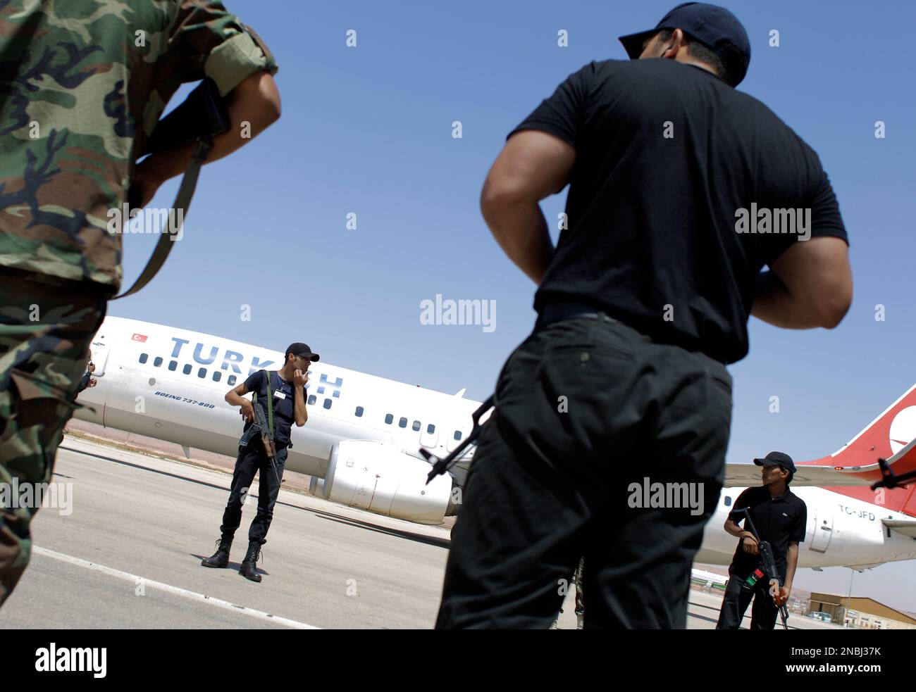 A Libyan security officers stand guard as Turkish foreign minister ...