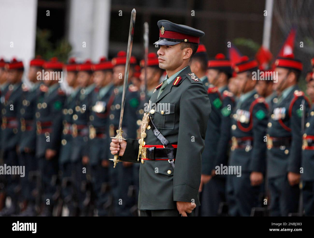 Nepalese soldiers present a guard of honor to Nepal's President Ram ...