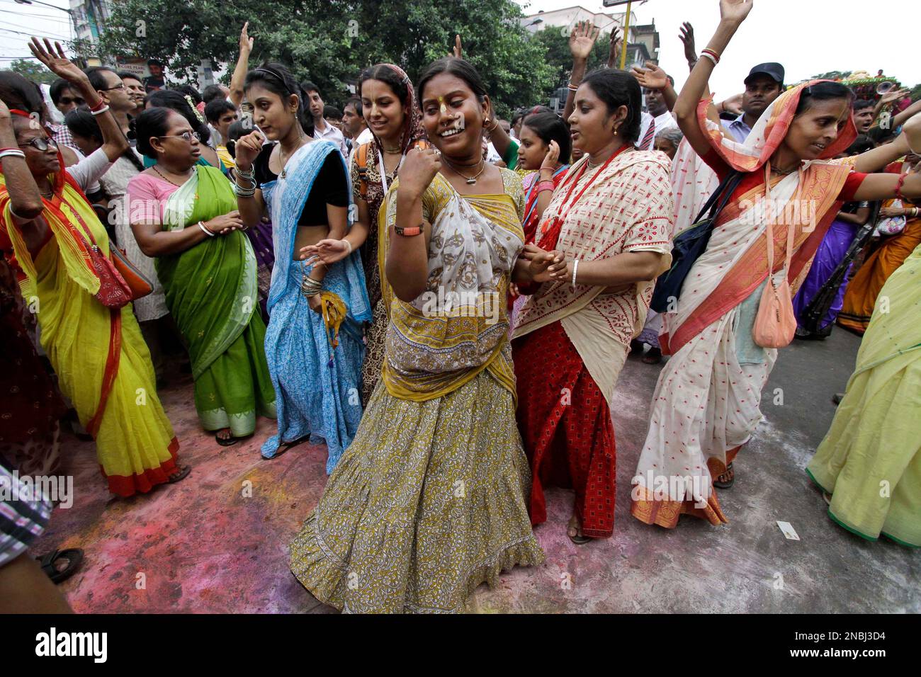 Hindu devotees dance during a chariot procession of lord Jagannath in ...