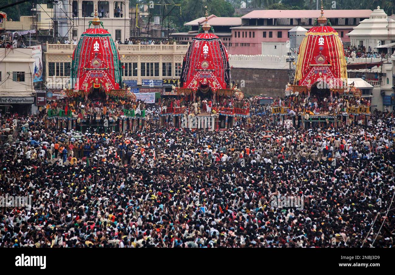 Devotees throng around chariots to pull it during the annual nine days ...