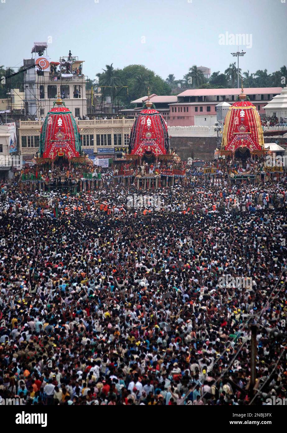 Devotees throng around chariots to pull it during the annual nine days ...