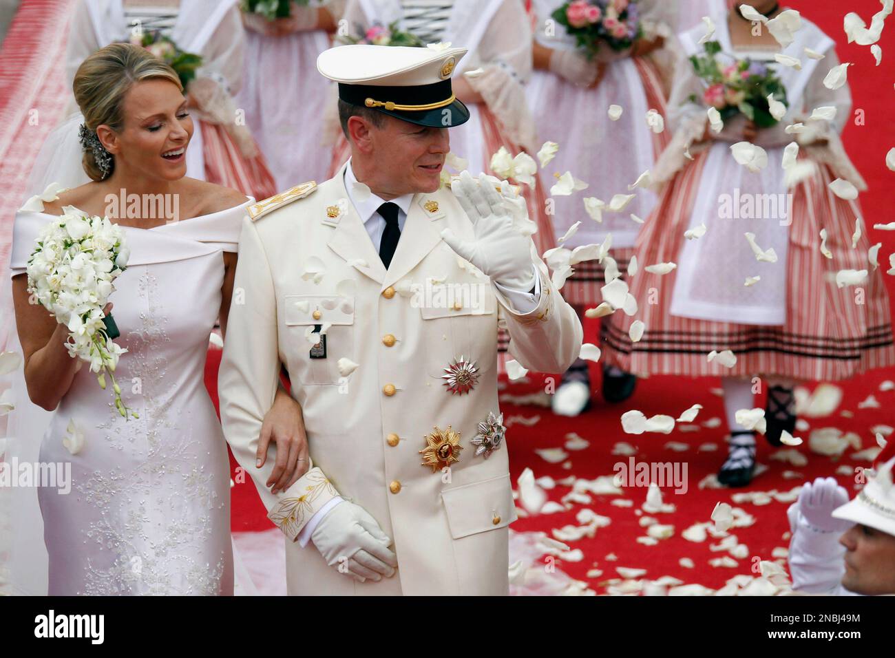 Monaco's Prince Albert II and Princess Charlene leave after the ...