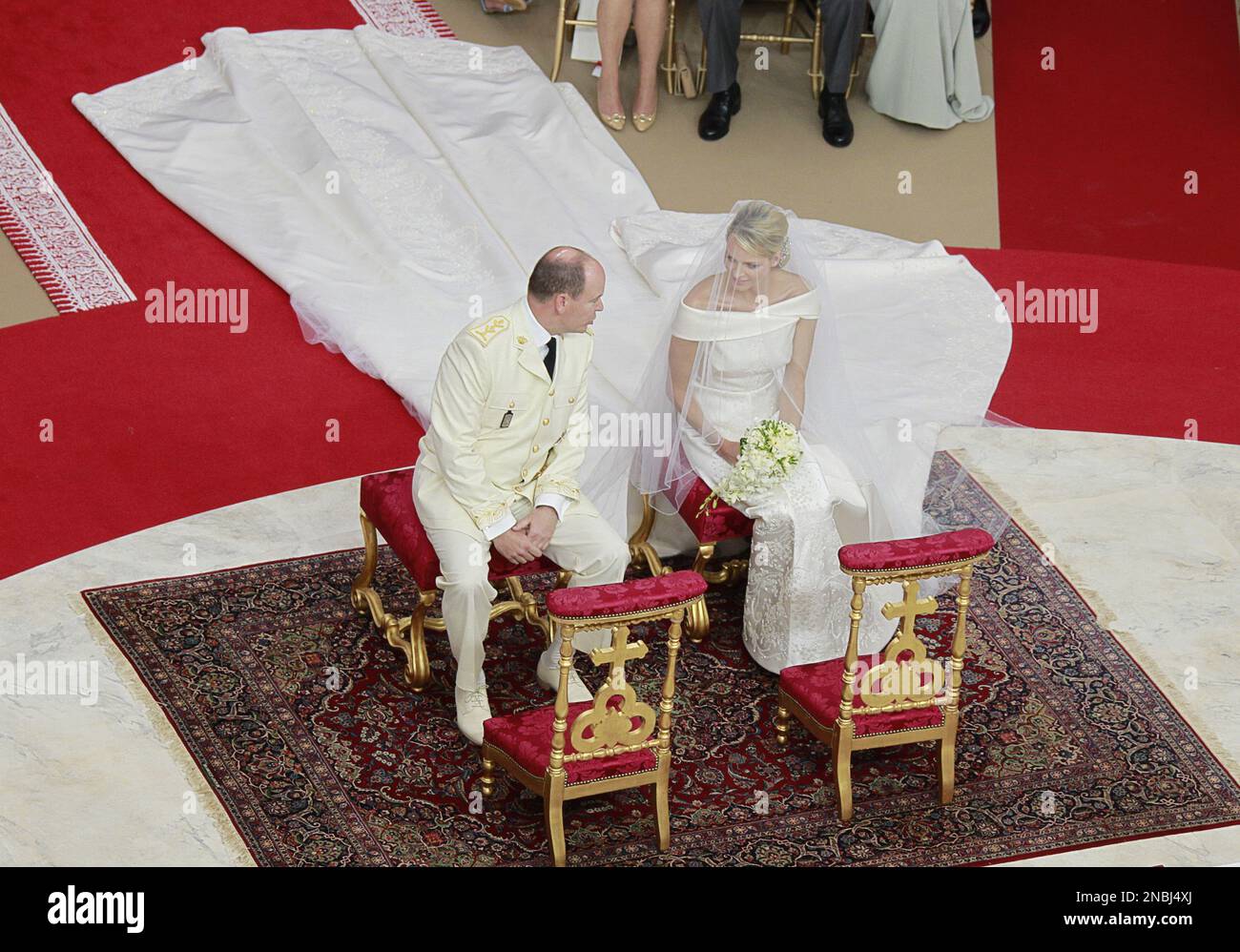 Prince Albert II of Monaco speaks to his bride Charlene Princess of ...