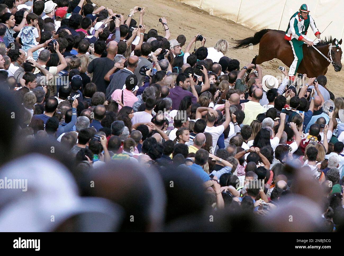 Rider Giovanni Atzeni of the Oca (Goose) neighborhood, rides on his way ...