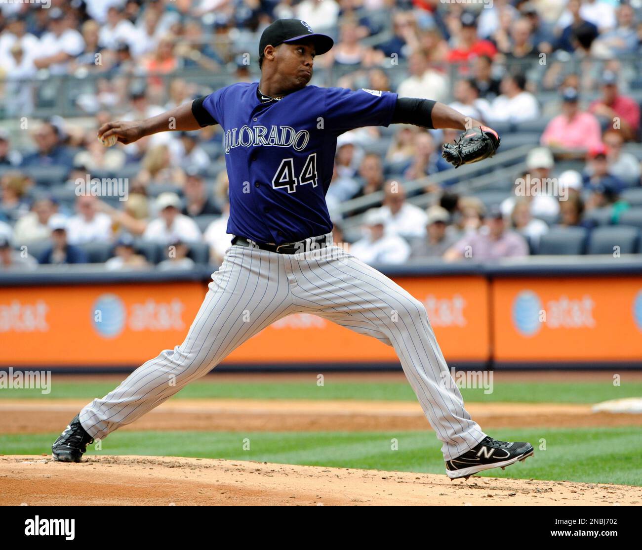 Colorado Rockies pitcher Juan Nicasio delivers the ball to the New York ...