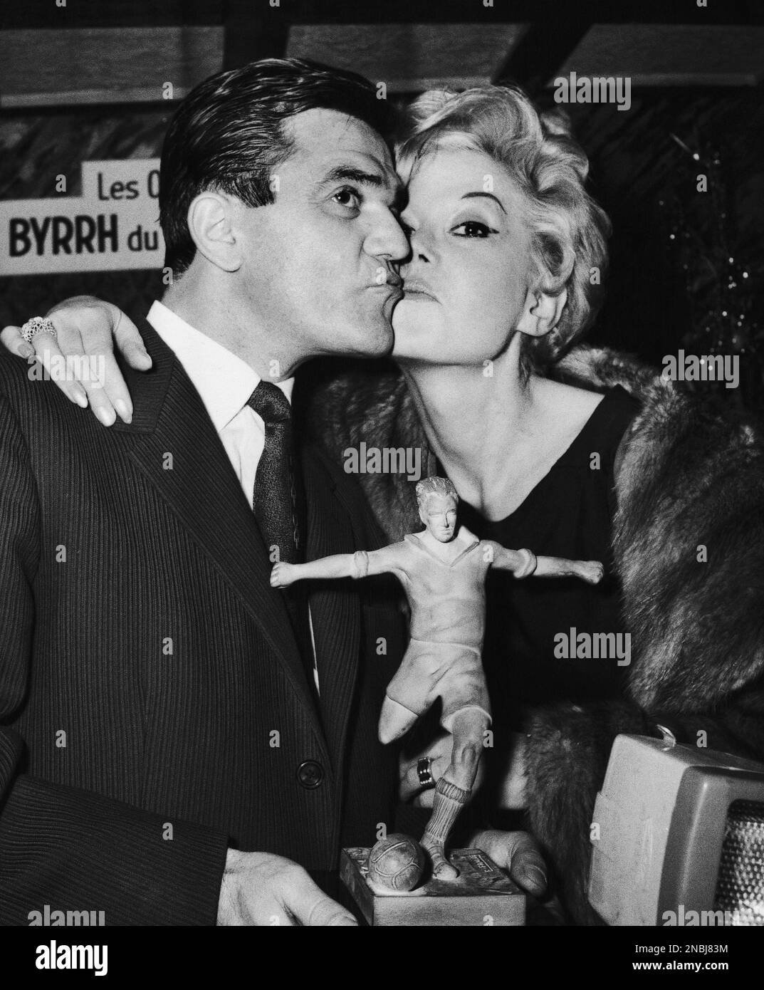 French footballer Joseph Ujlaki gets a kiss from French soprano Mathe ...