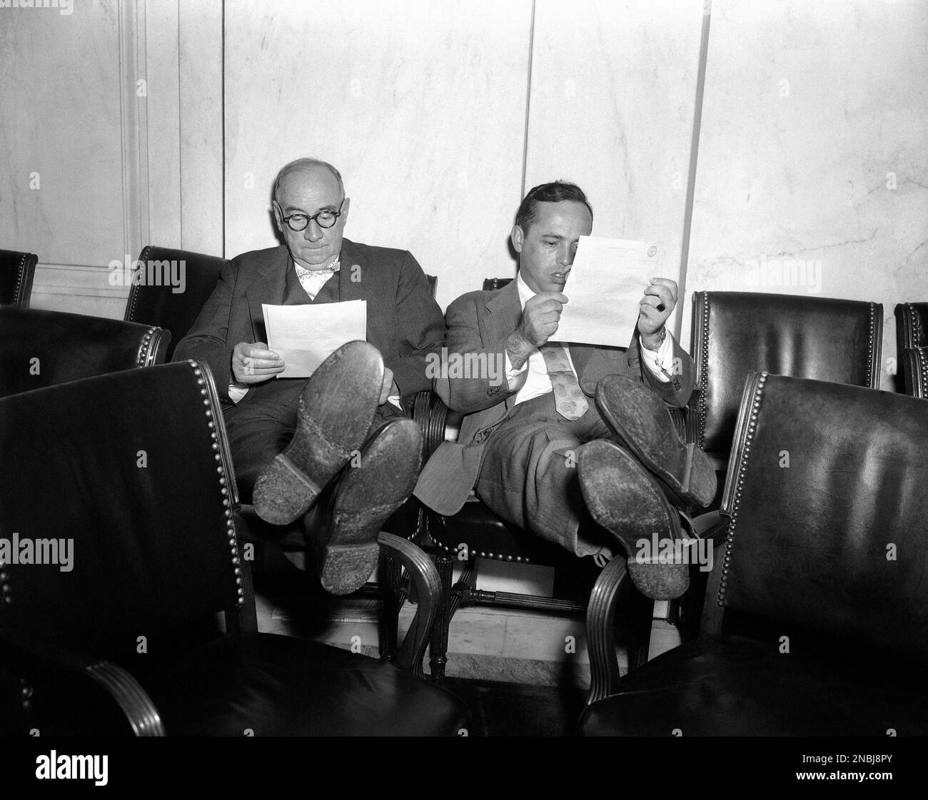Army Counsel Joseph Welch and his aide, James St. Clair, prop their ...